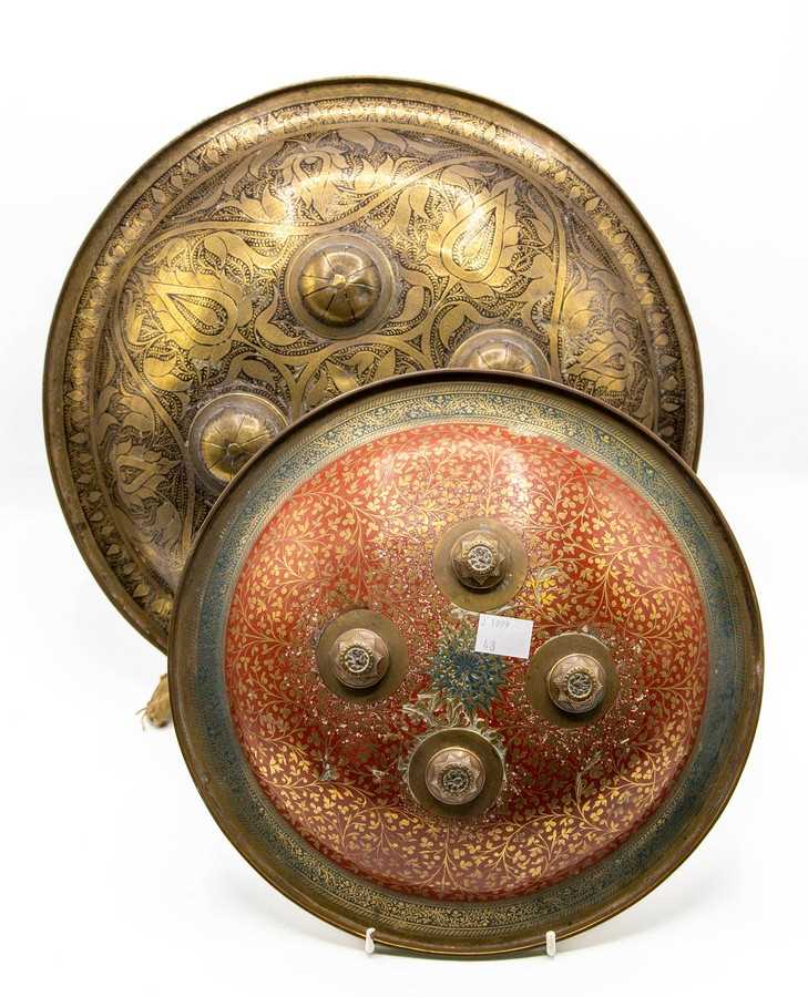 Lot 520 - An Indian brass and enamel circular shield,