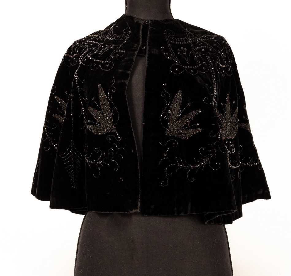 Lot 297 - A Victorian black velvet cape with applied