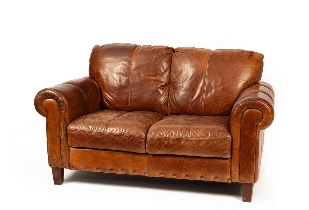 Lot 522 - A modern leather two-seater sofa, 150cm wide,