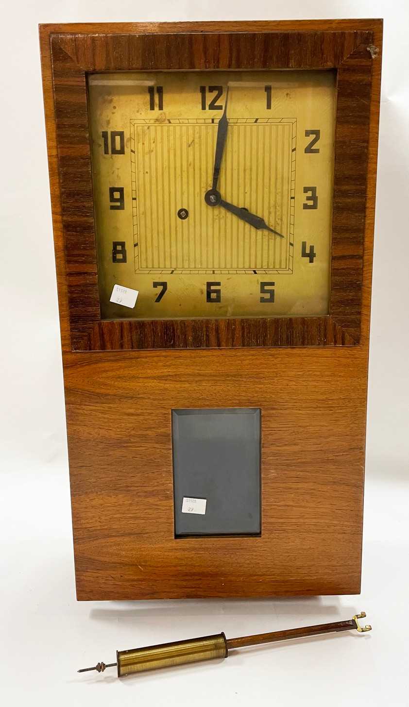 Lot 480 - A 1930s walnut wall clock, fitted a