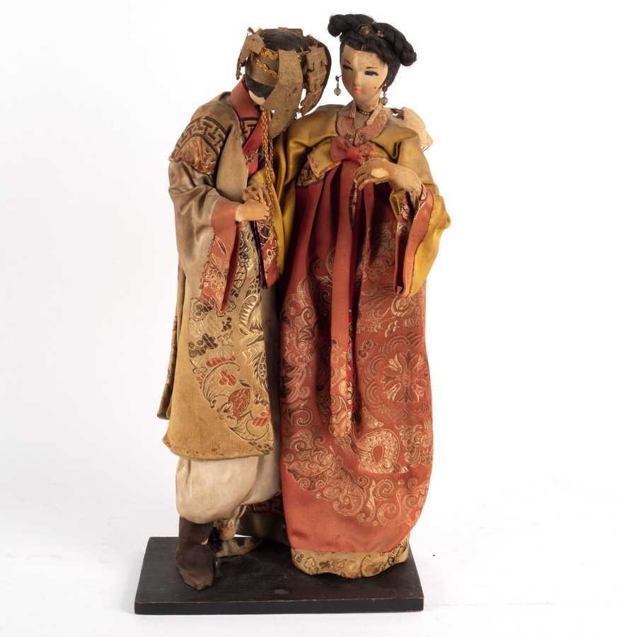 Lot 345 - Two Japanese composition dolls in brocade