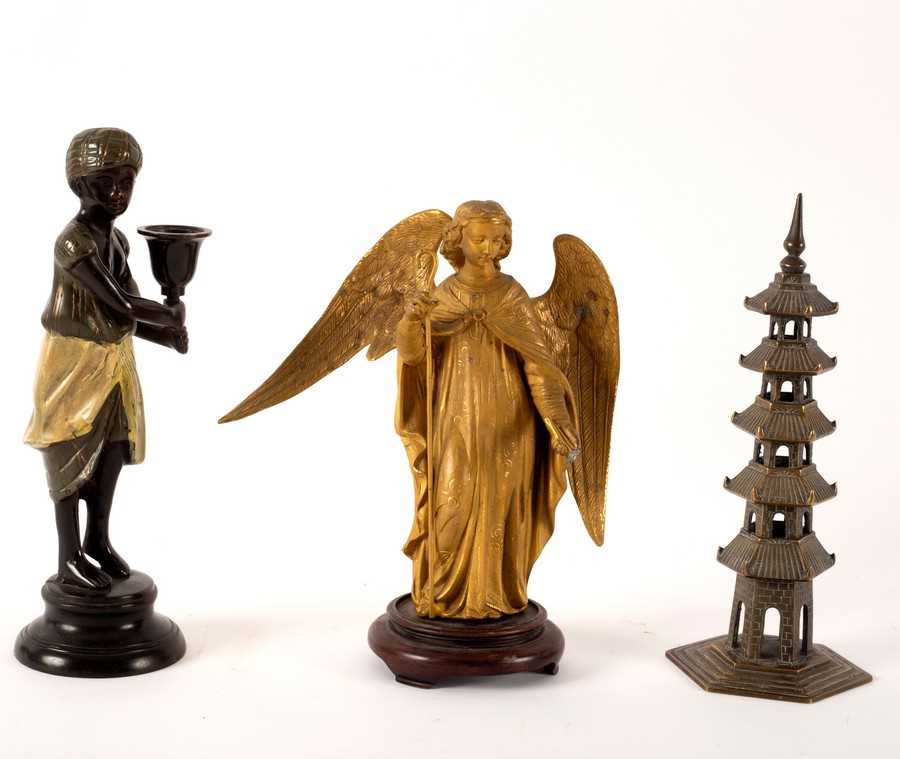 Lot 399 - A bronzed metal candlestick figure of a