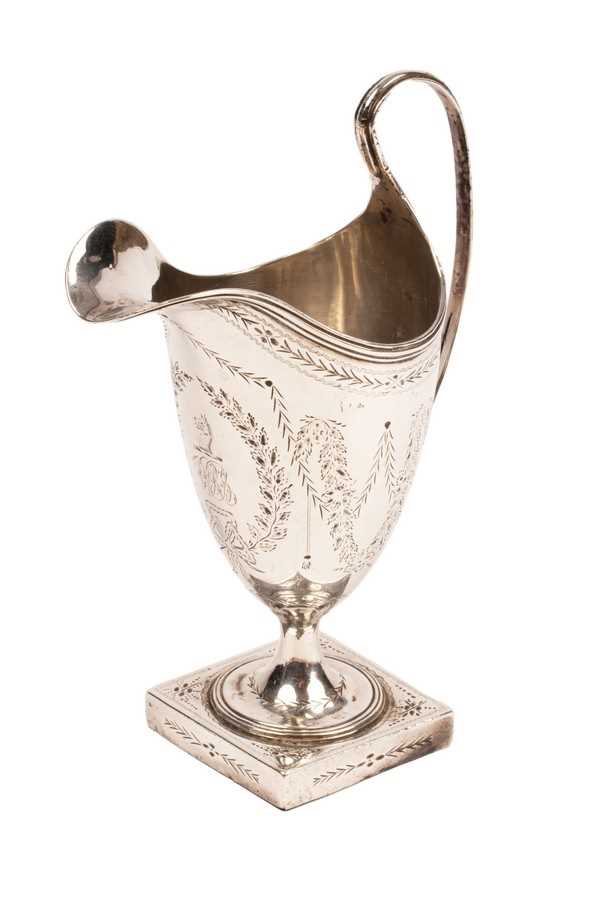 Lot 199 - A George III silver jug, Hester Bateman,