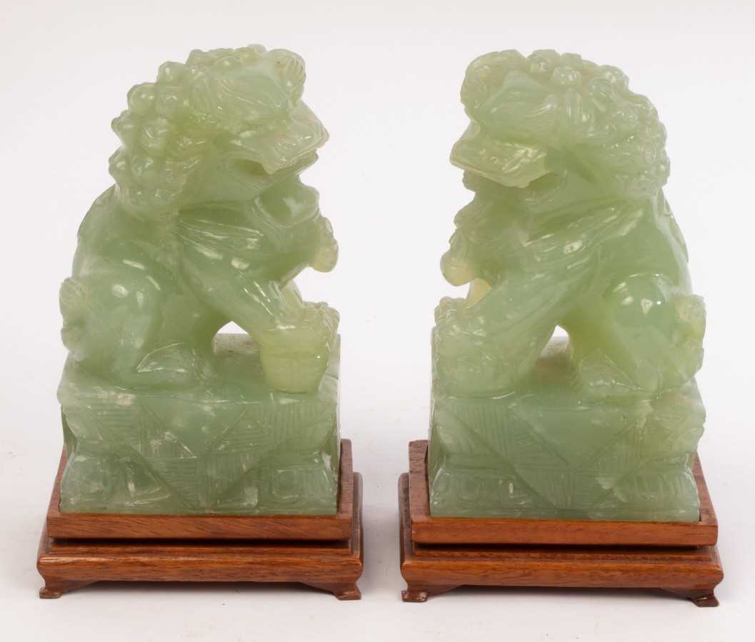 Lot 690 - A pair of Chinese jade carved Foo dogs on