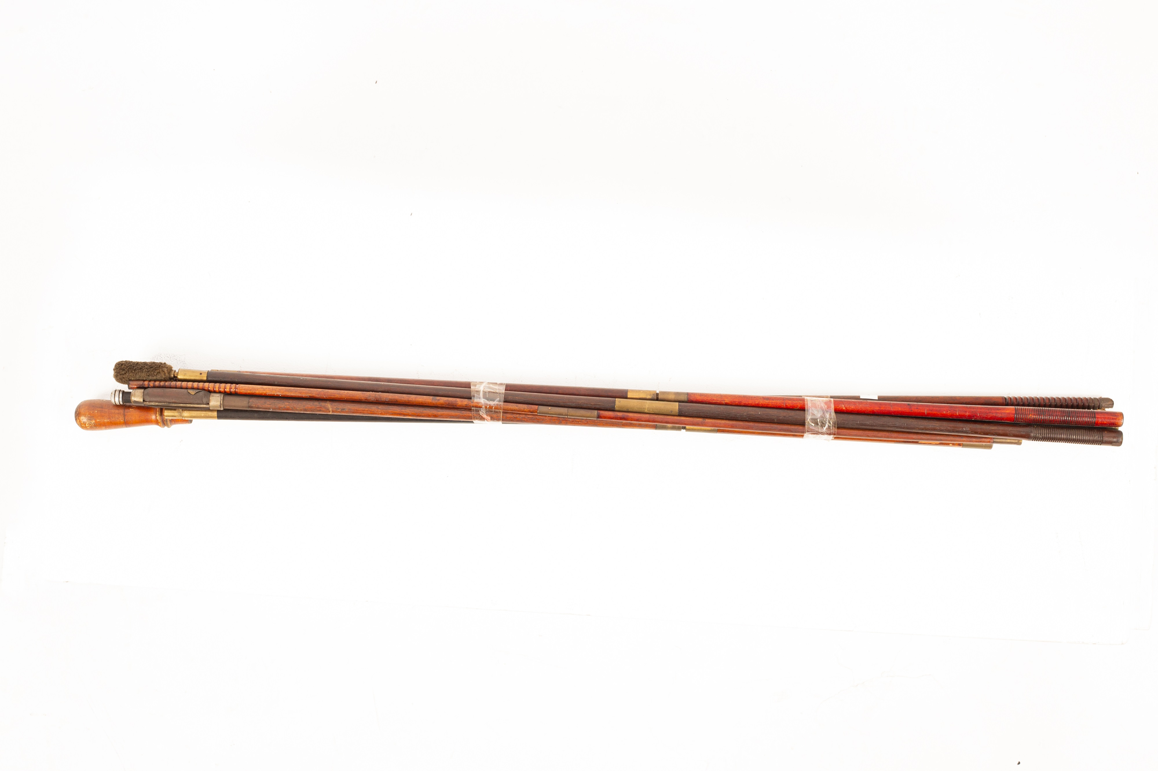 Lot 220 - Eight turned wood, brass mounted gun rods