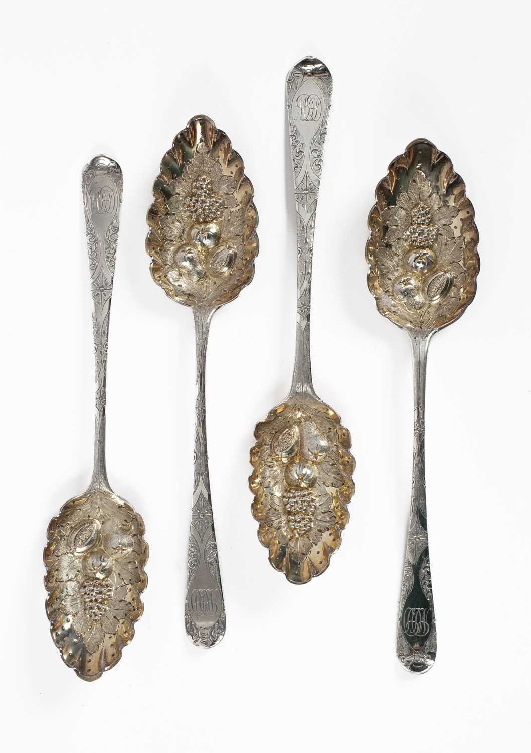 Lot 7 - Four George III silver berry spoons