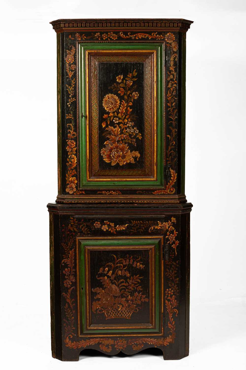 Lot 687 - A Continental relief painted corner cabinet