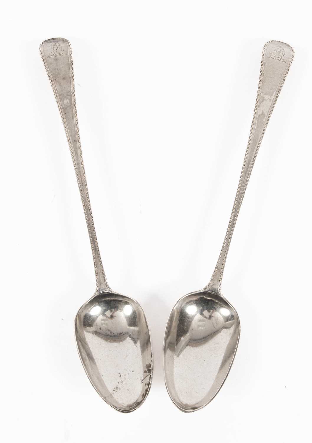 Lot 411 - A pair of George III feather edge silver