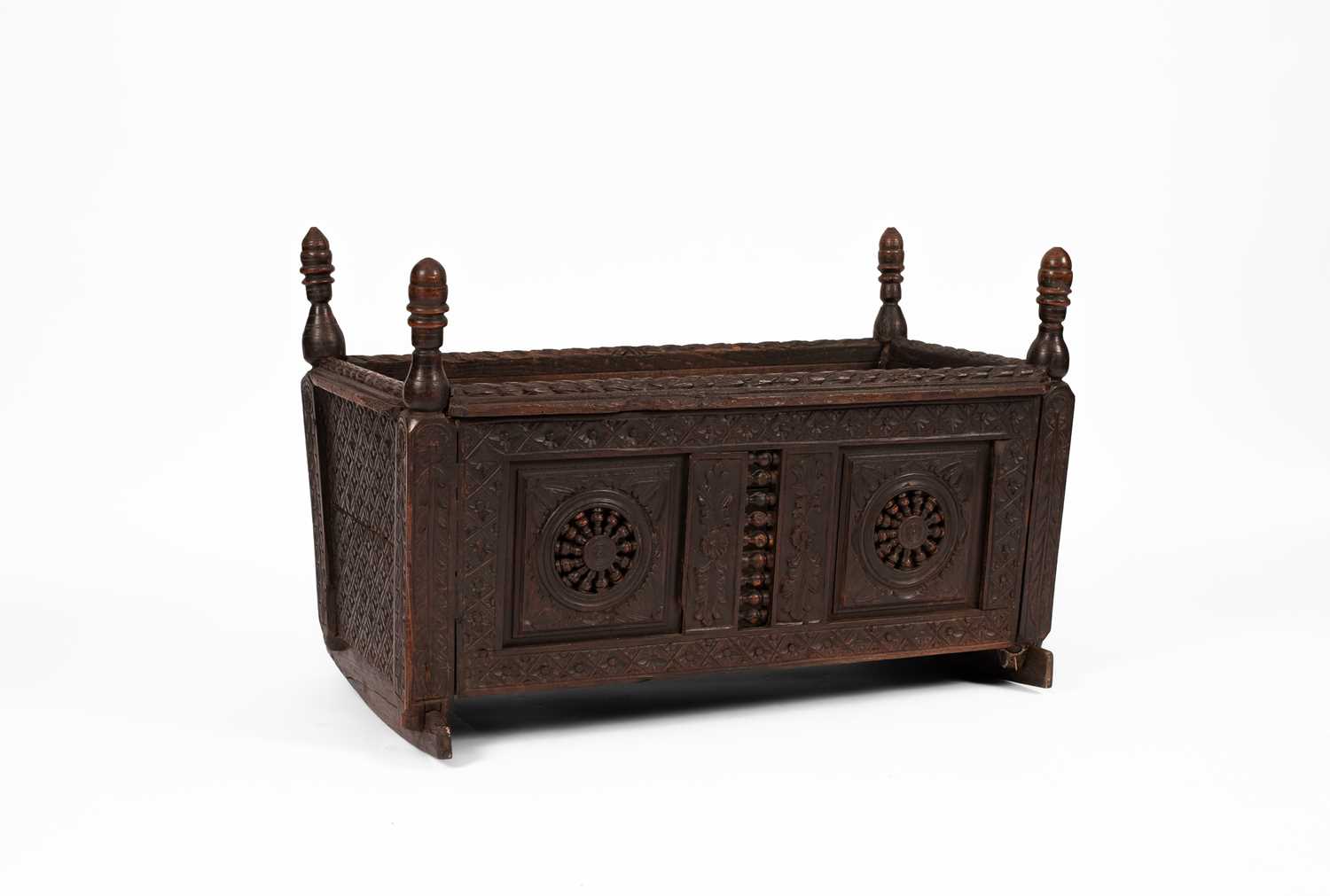 Lot 356 - An oak carved cradle