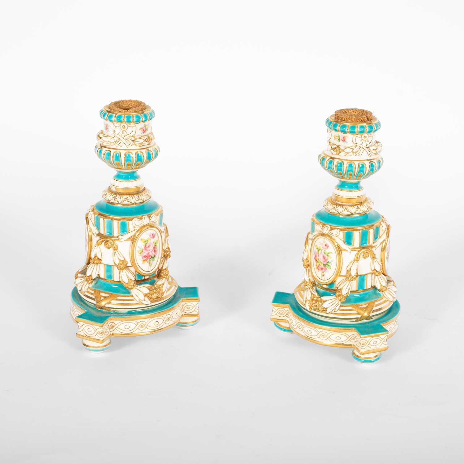 Lot 494 - A pair of Minton candlesticks